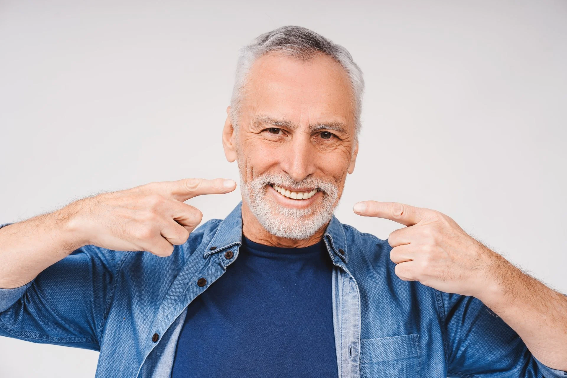 Dental Implants vs Dentures: Pros & Differences | Tkatch Dentistry